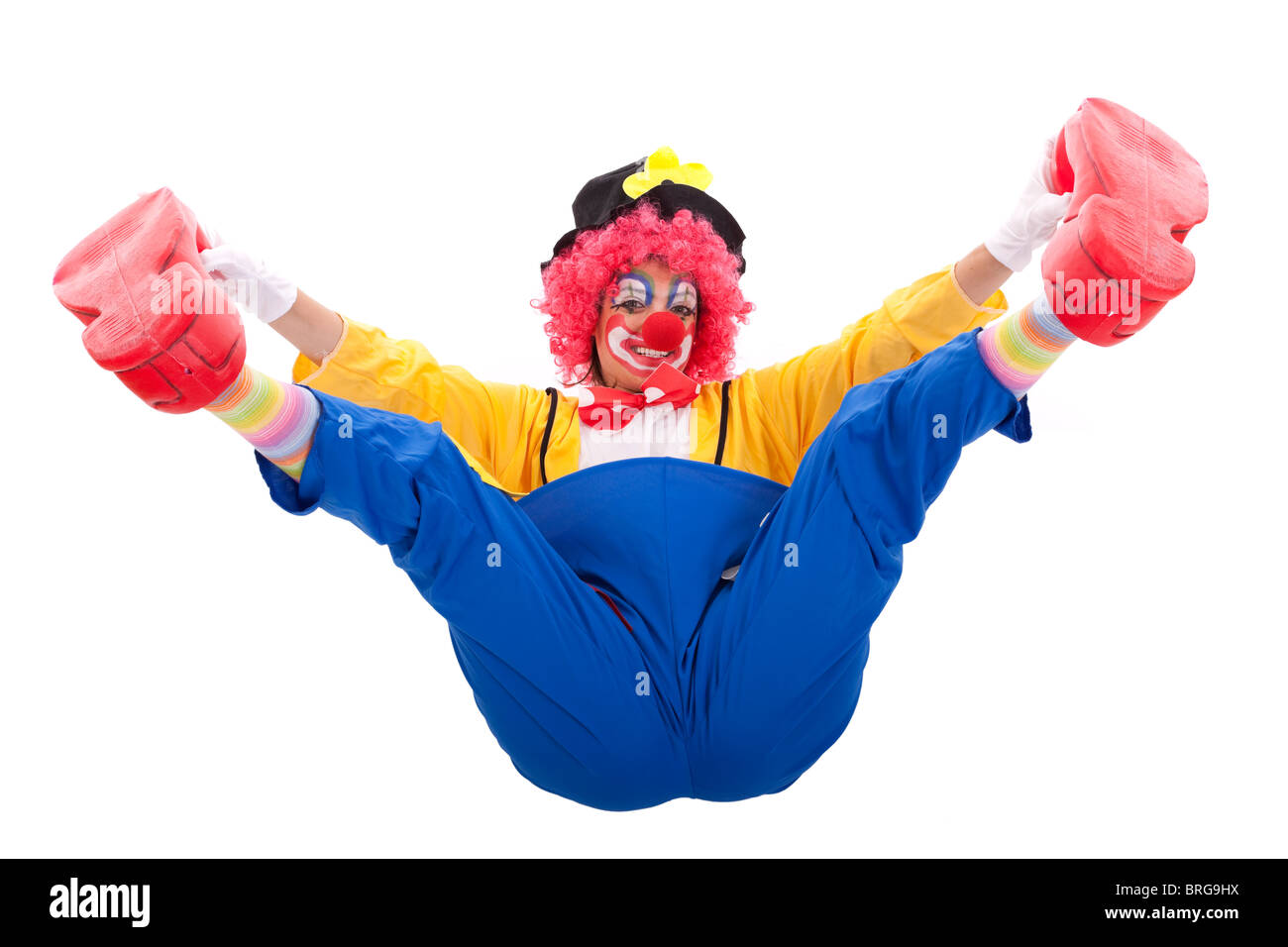 funny circus clown falling on the floor (isolated on white Stock Photo ...