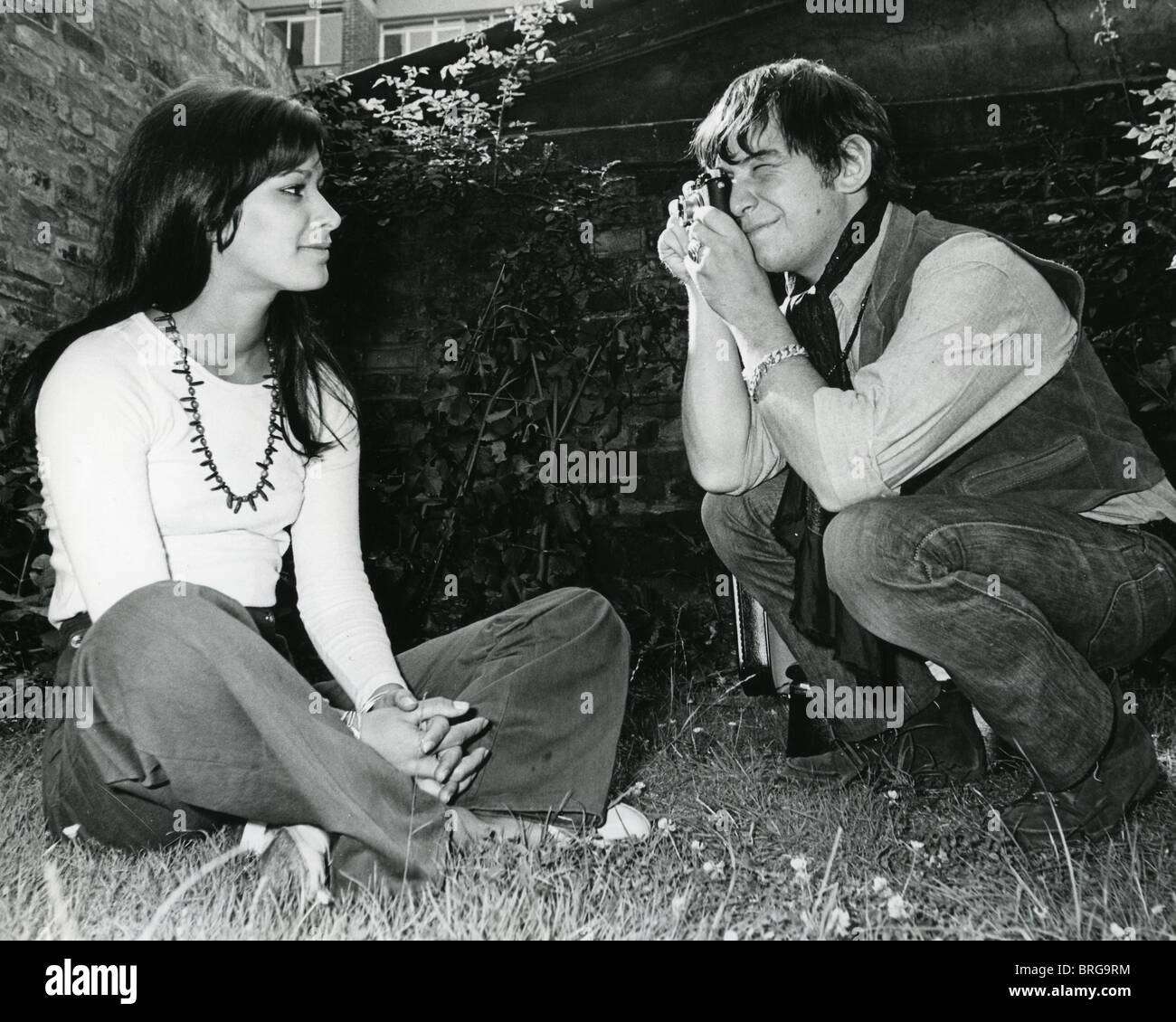 ERIC BURDON Singer with pop group the Animals photographing girlfriend ...