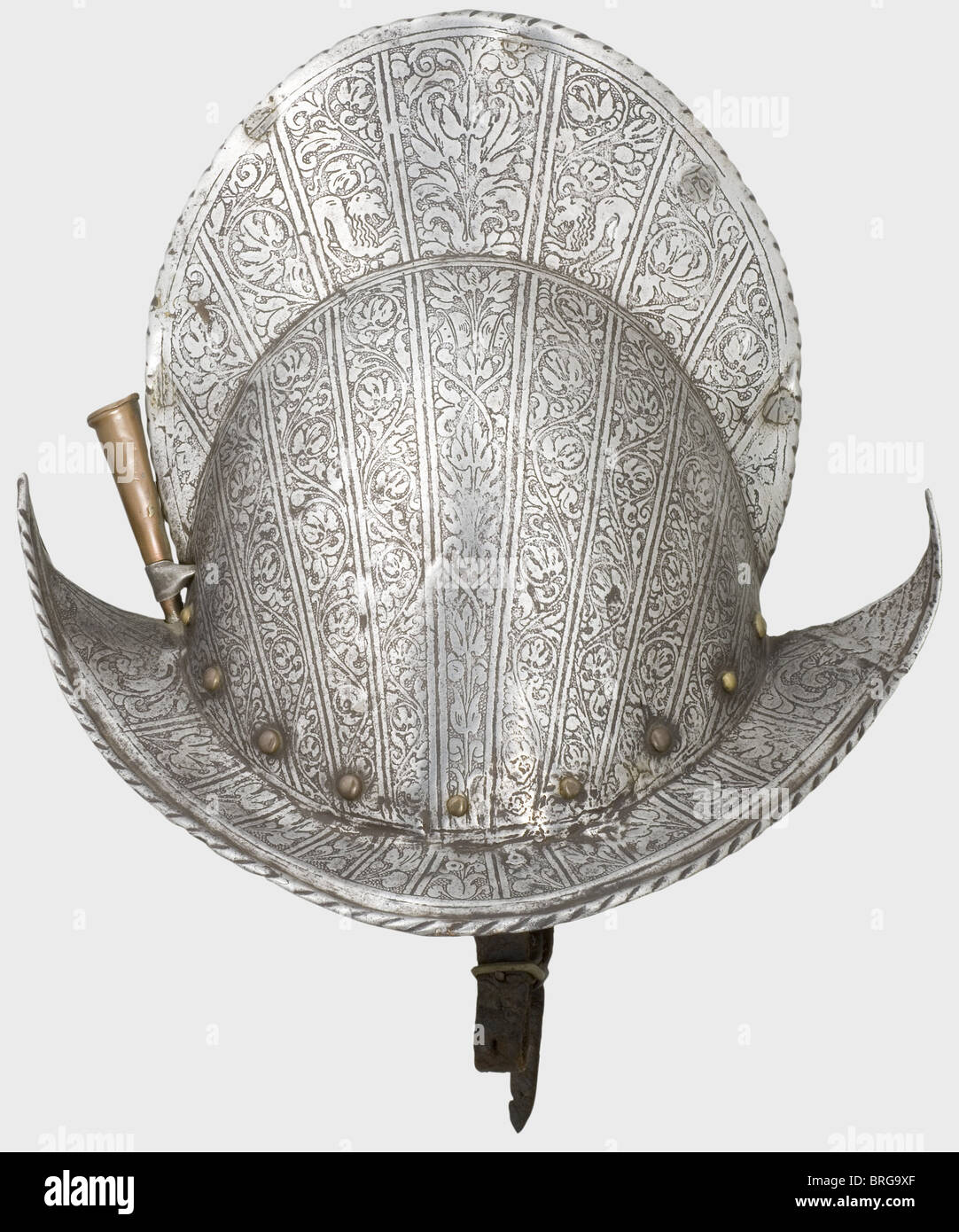 An etched Italian morion,circa 1590 The skull formed in one piece with ...