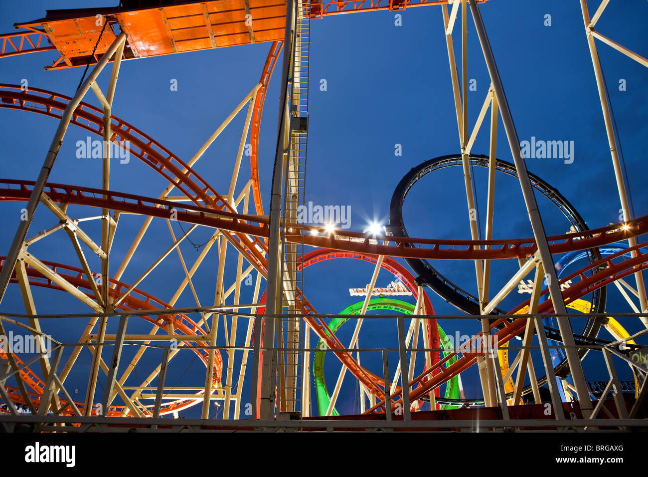 Roller coaster lit up at night at the Oktoberfest, Munich Stock Photo ...