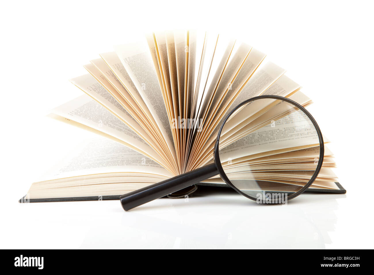 Book magnifying glass over white hi-res stock photography and images ...
