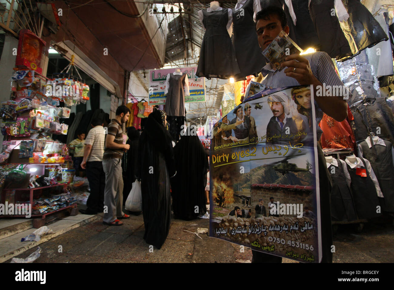 A Vendor selling DVD movies in Qaysari bazaar in the city of Erbil also ...