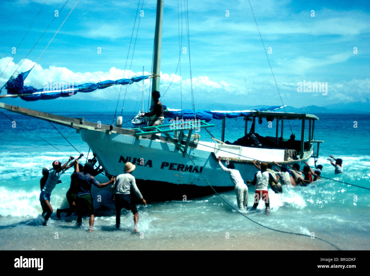 Inter-island supply ship arriving in rough weather on Nusa Penida ...