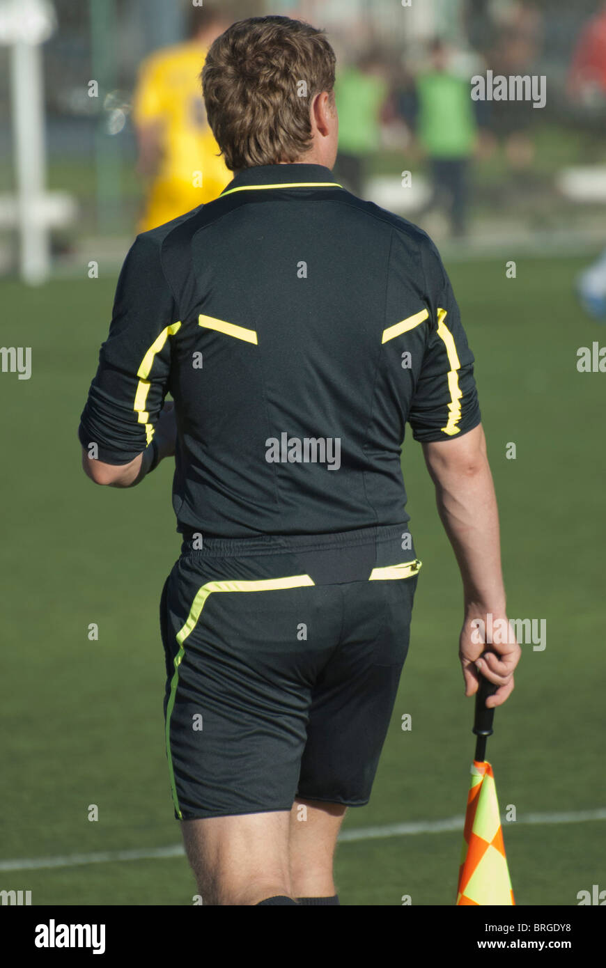 Side referee going along of the pitch border Stock Photo - Alamy