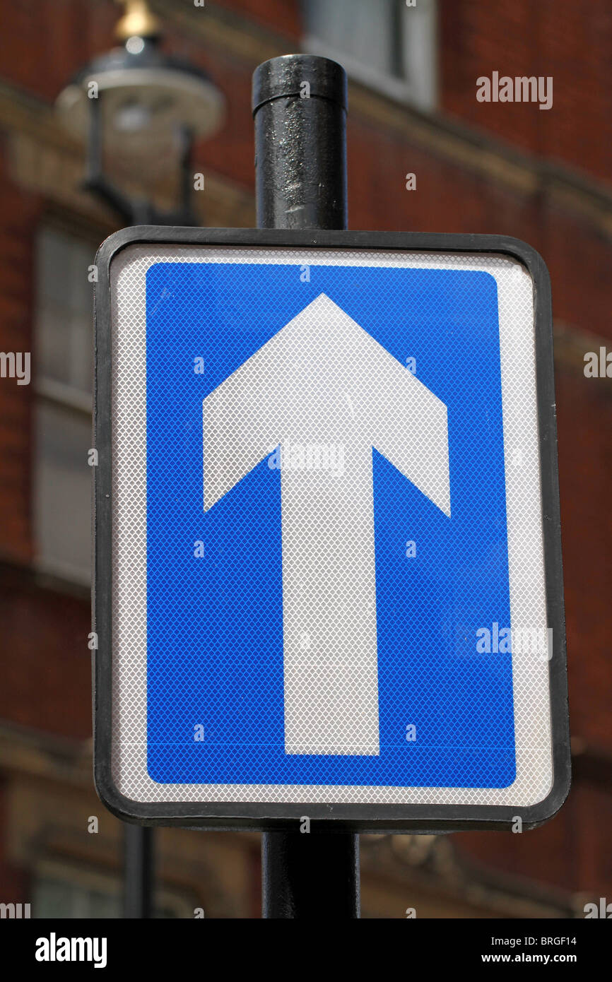 White arrow one way street sign in London, England Stock Photo - Alamy