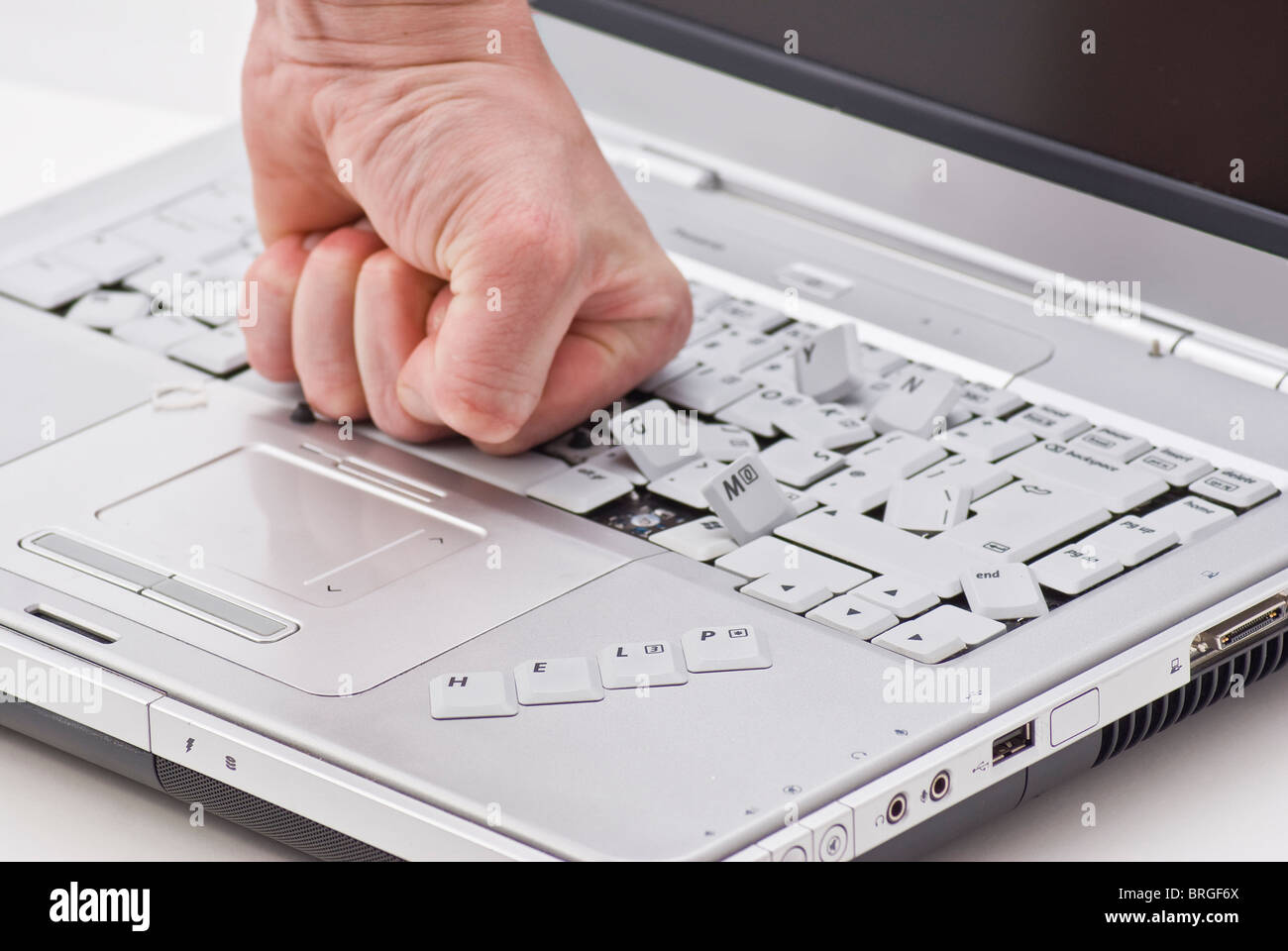 By hand damaged laptop on white background with "help" word Stock Photo ...