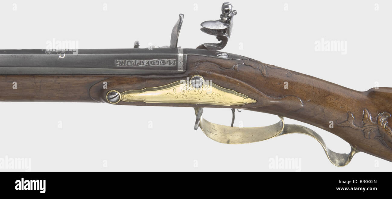 A German flintlock rifle,circa 1780.Two-stage barrel,octagonal then ...