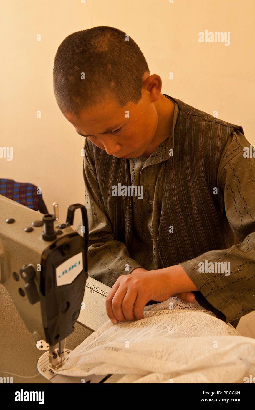 child learning to become a tailor in Kabul Afghanistan Stock Photo - Alamy