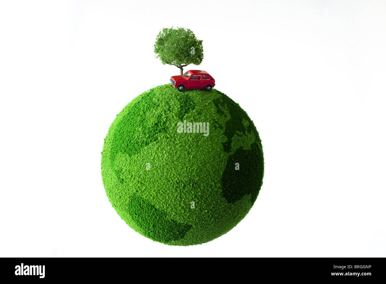 Red car on green earth Stock Photo - Alamy