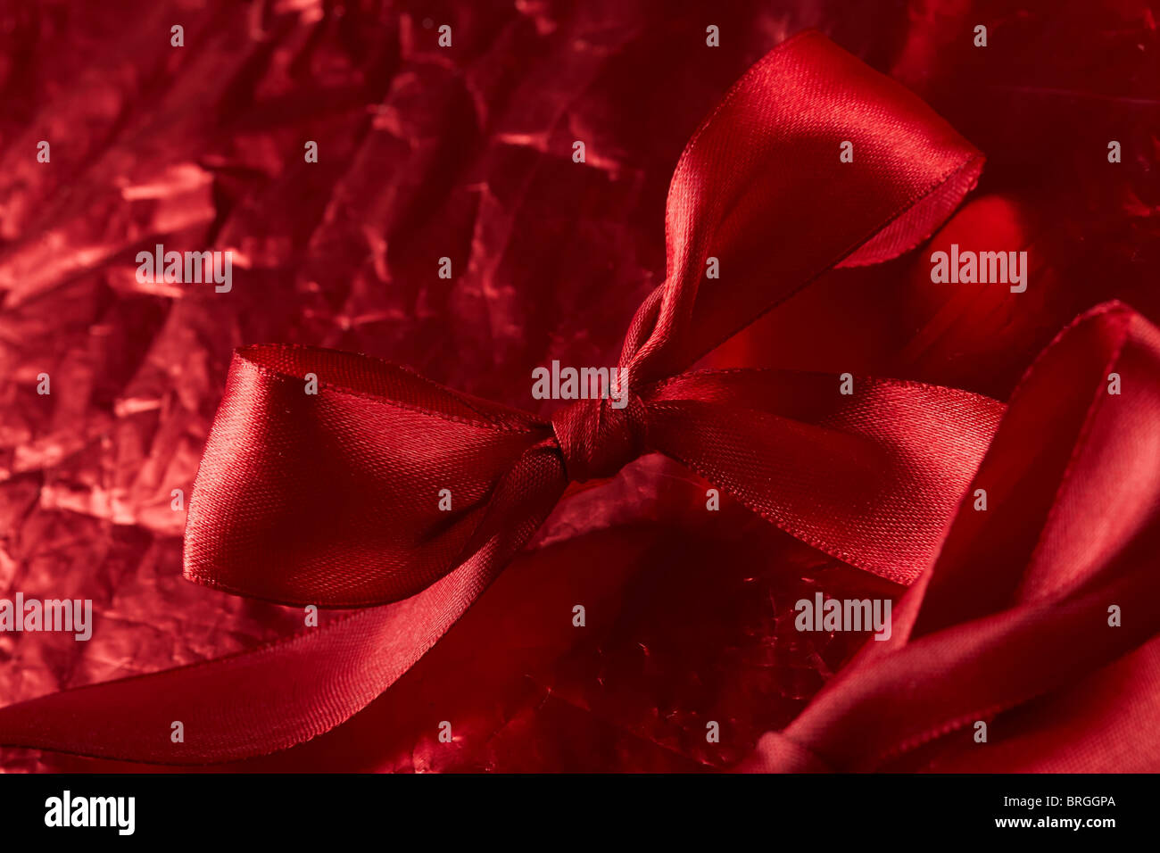 satin ribbons on the red background Stock Photo - Alamy