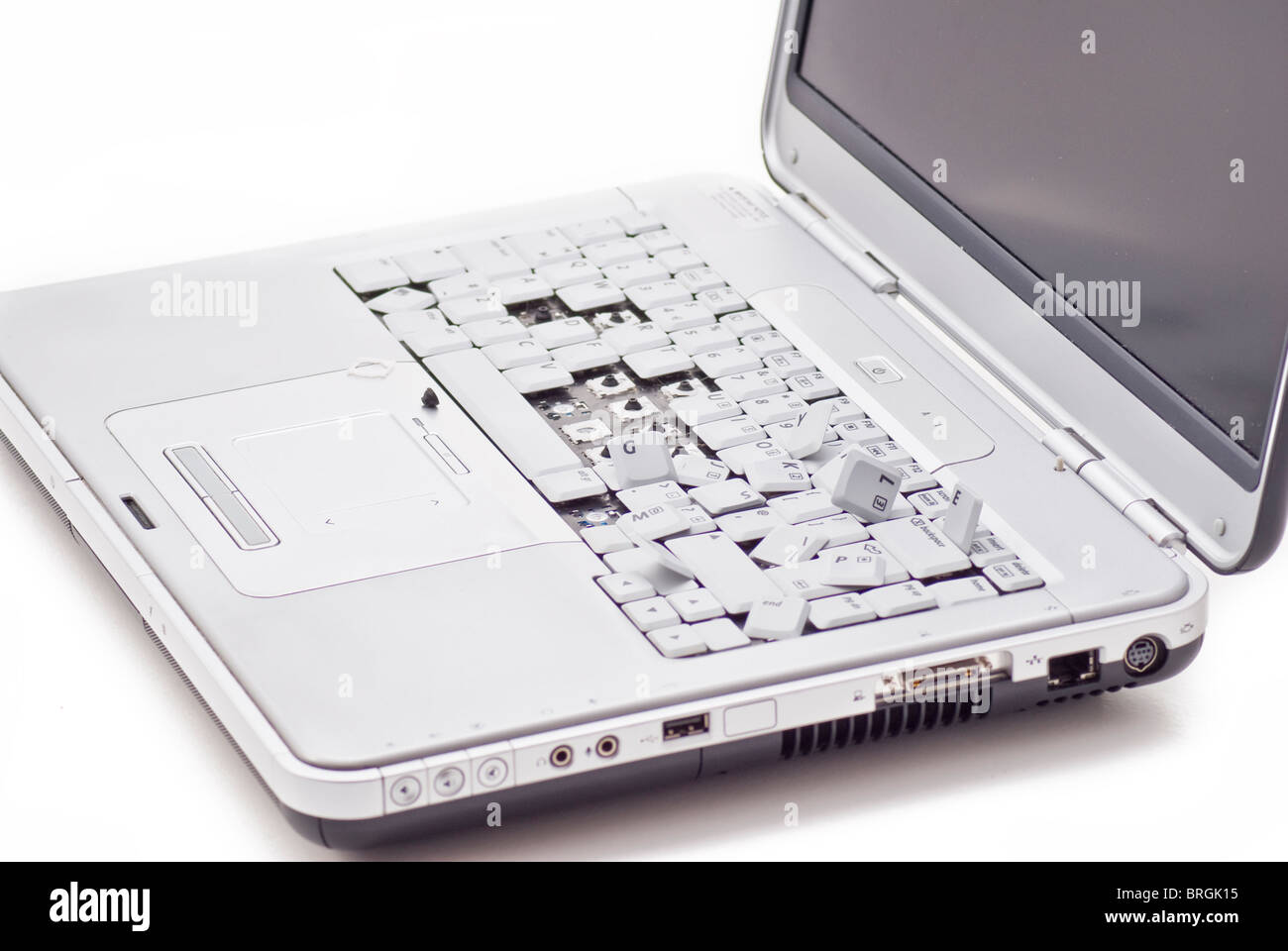 Damaged laptop keyboard with teared out keys Stock Photo - Alamy