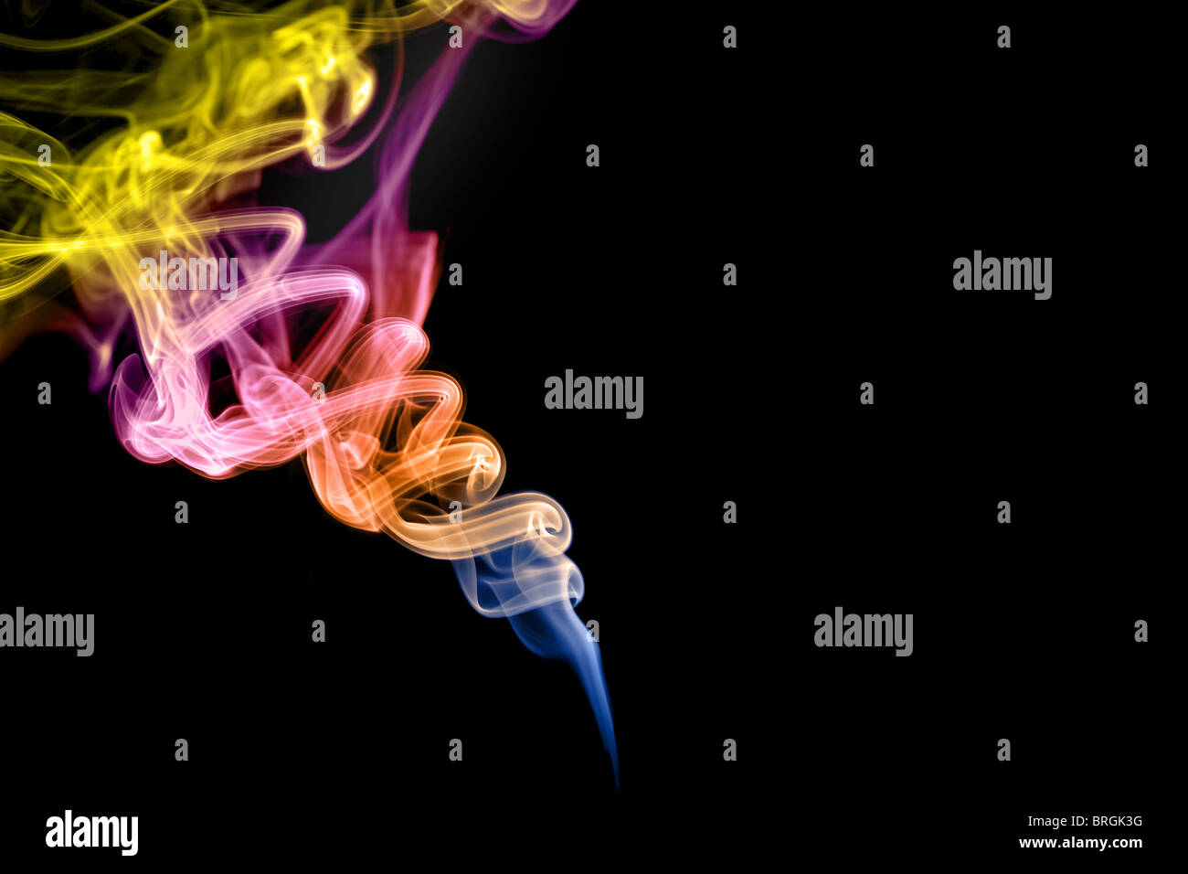 rainbow colored smoke streaming up and left on a black background Stock ...