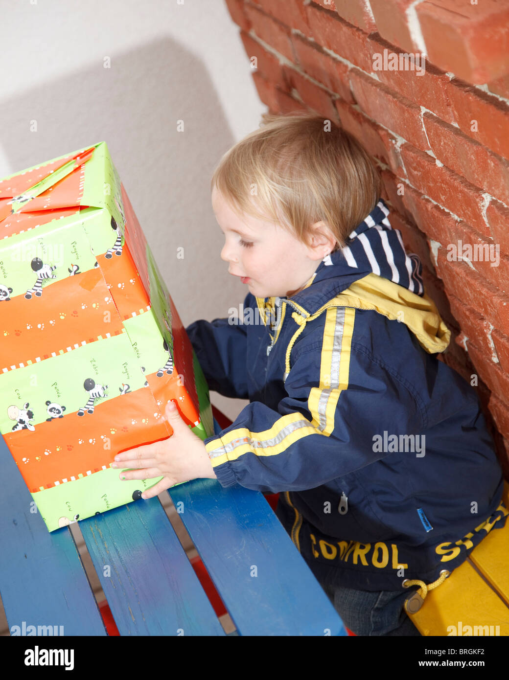 little boy with present Stock Photo - Alamy