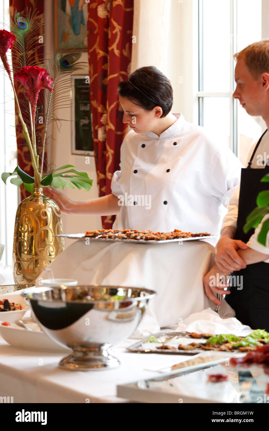 waitress at buffet Stock Photo - Alamy