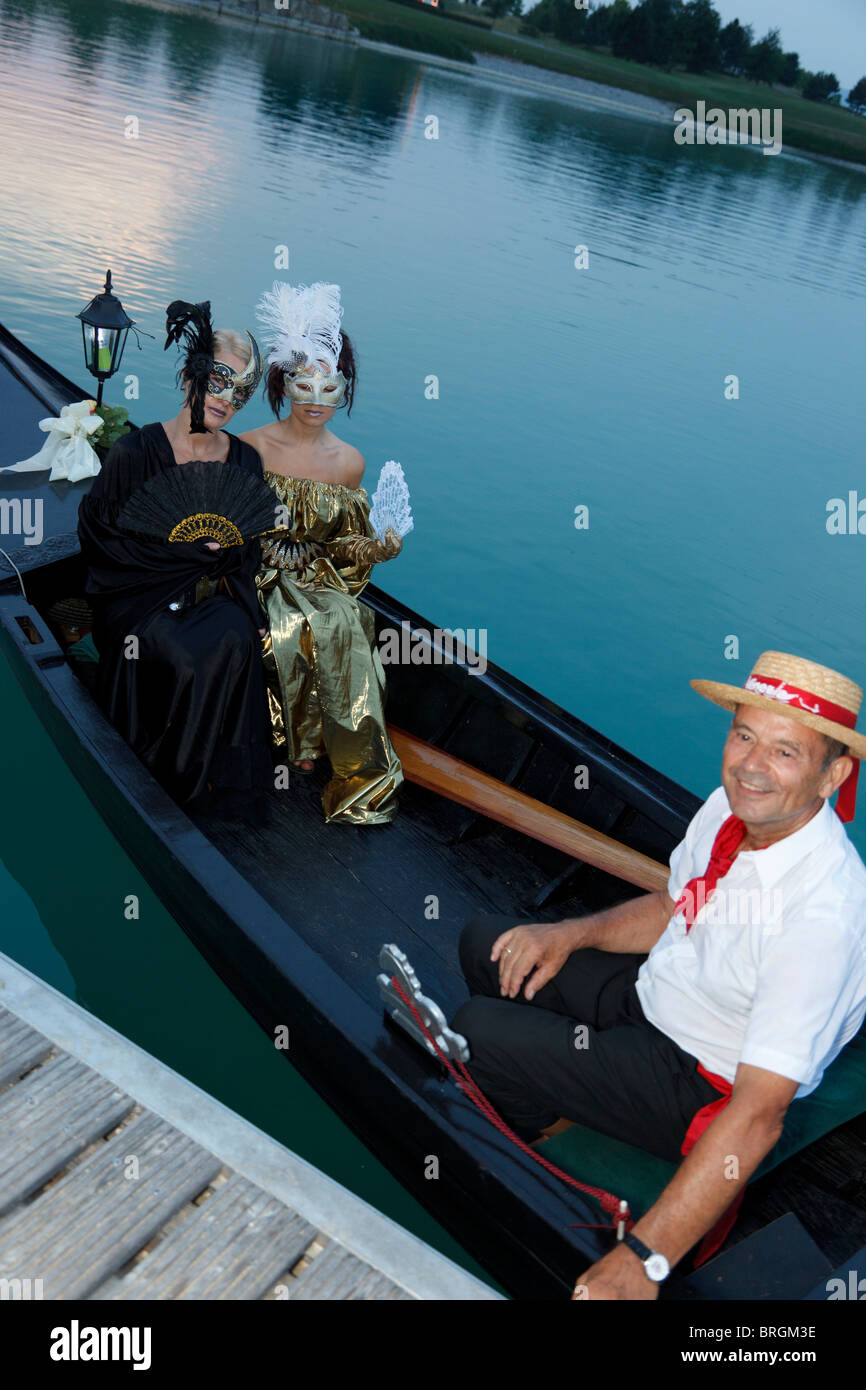 women with Venetian dress in Venetian gondola Stock Photo - Alamy