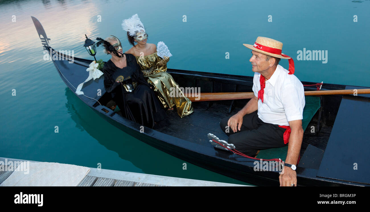women with Venetian dress in Venetian gondola Stock Photo - Alamy