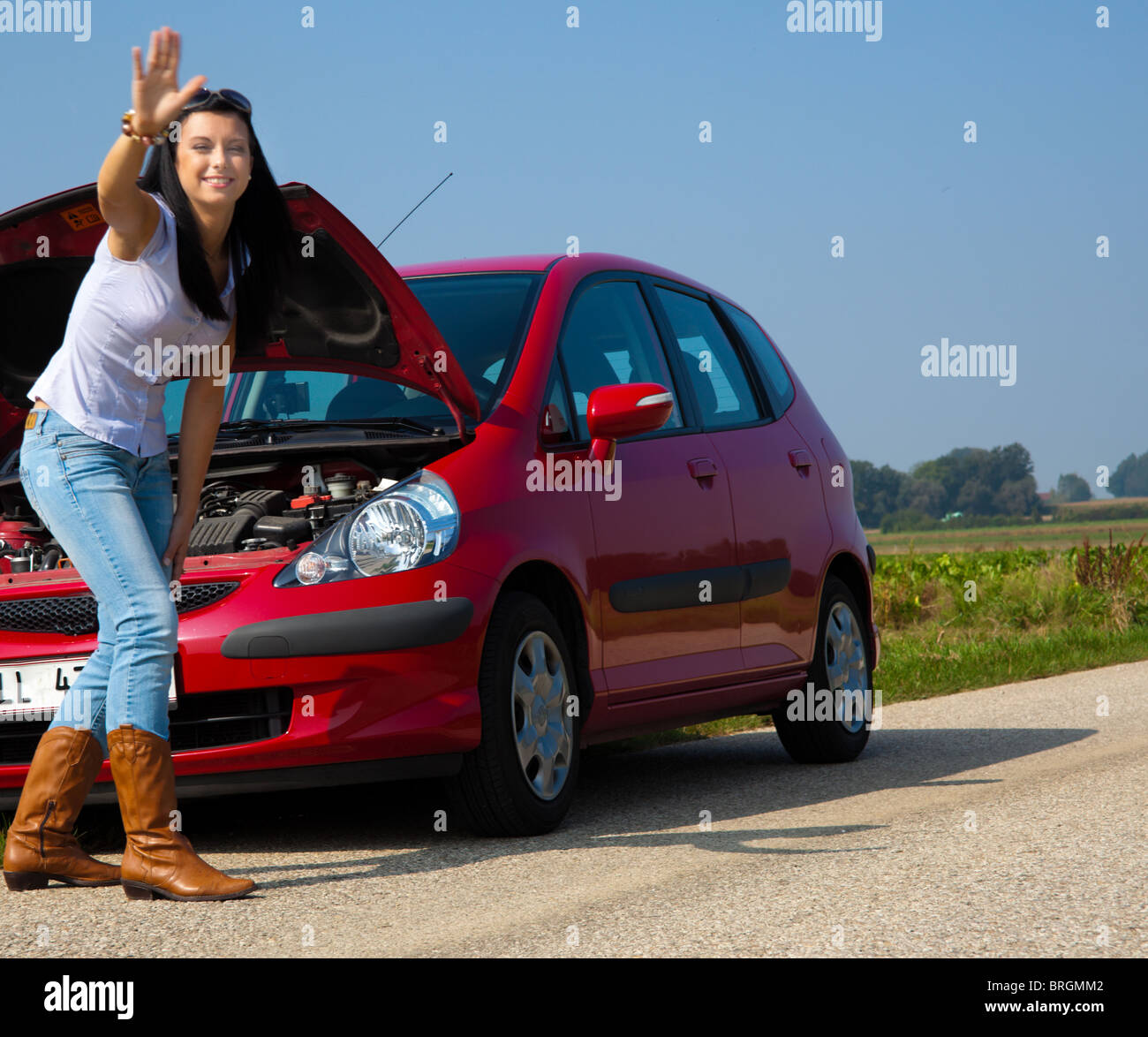 Young woman with her car breakdown. Engine failure Stock Photo - Alamy