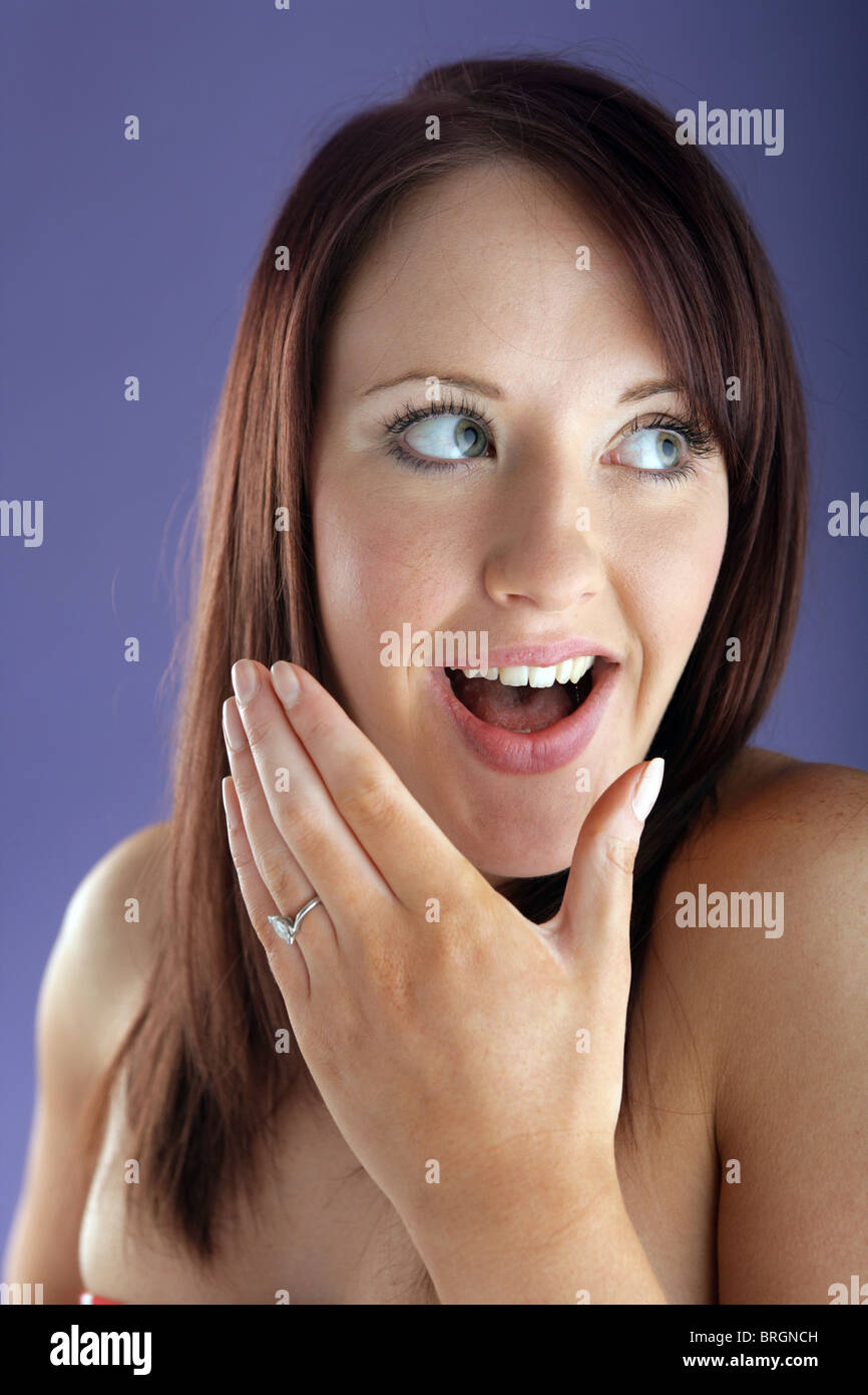 Pretty girl with a shocked surprised expression Stock Photo - Alamy