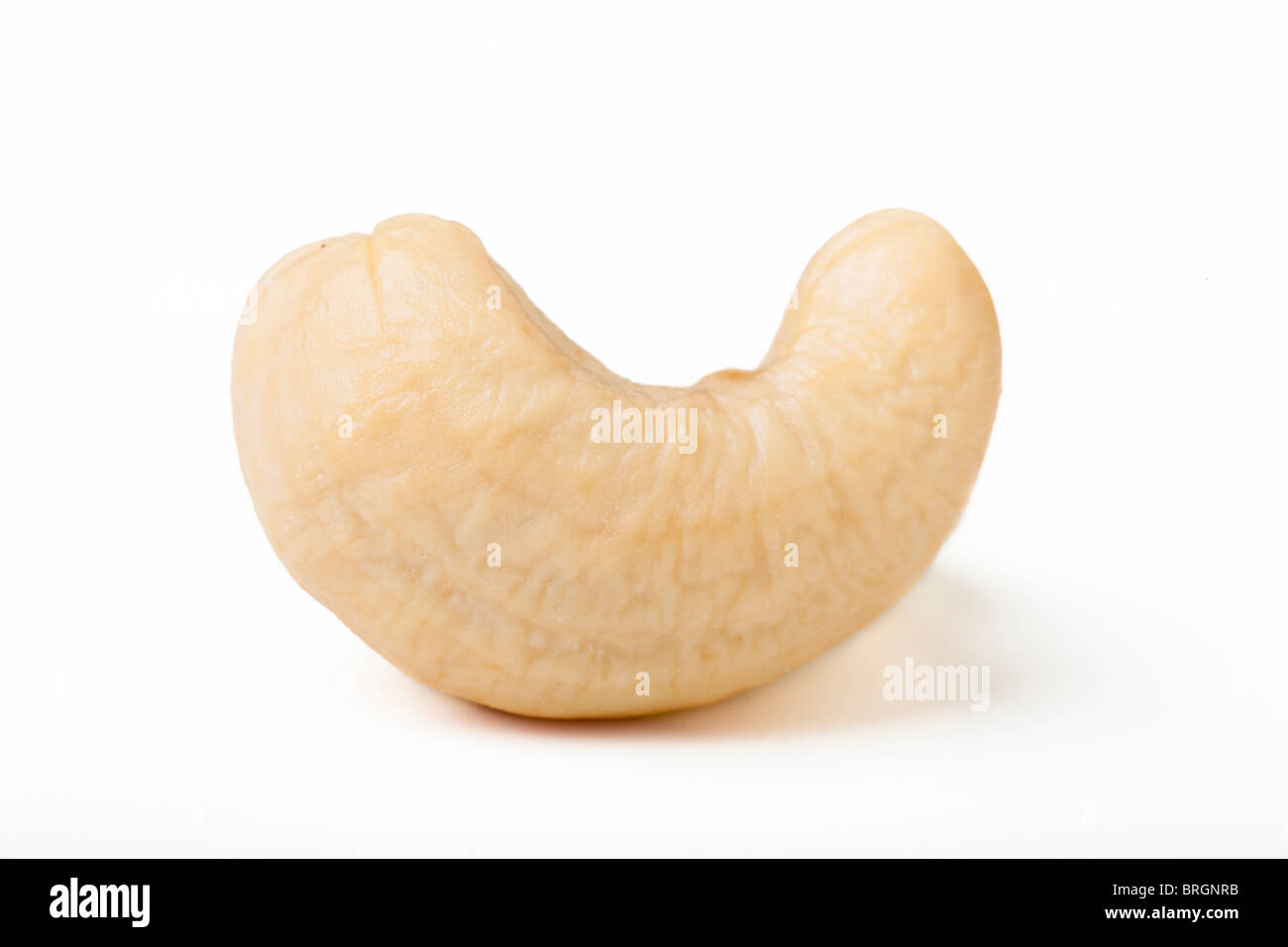 Single cashew nut isolated on white background Stock Photo - Alamy