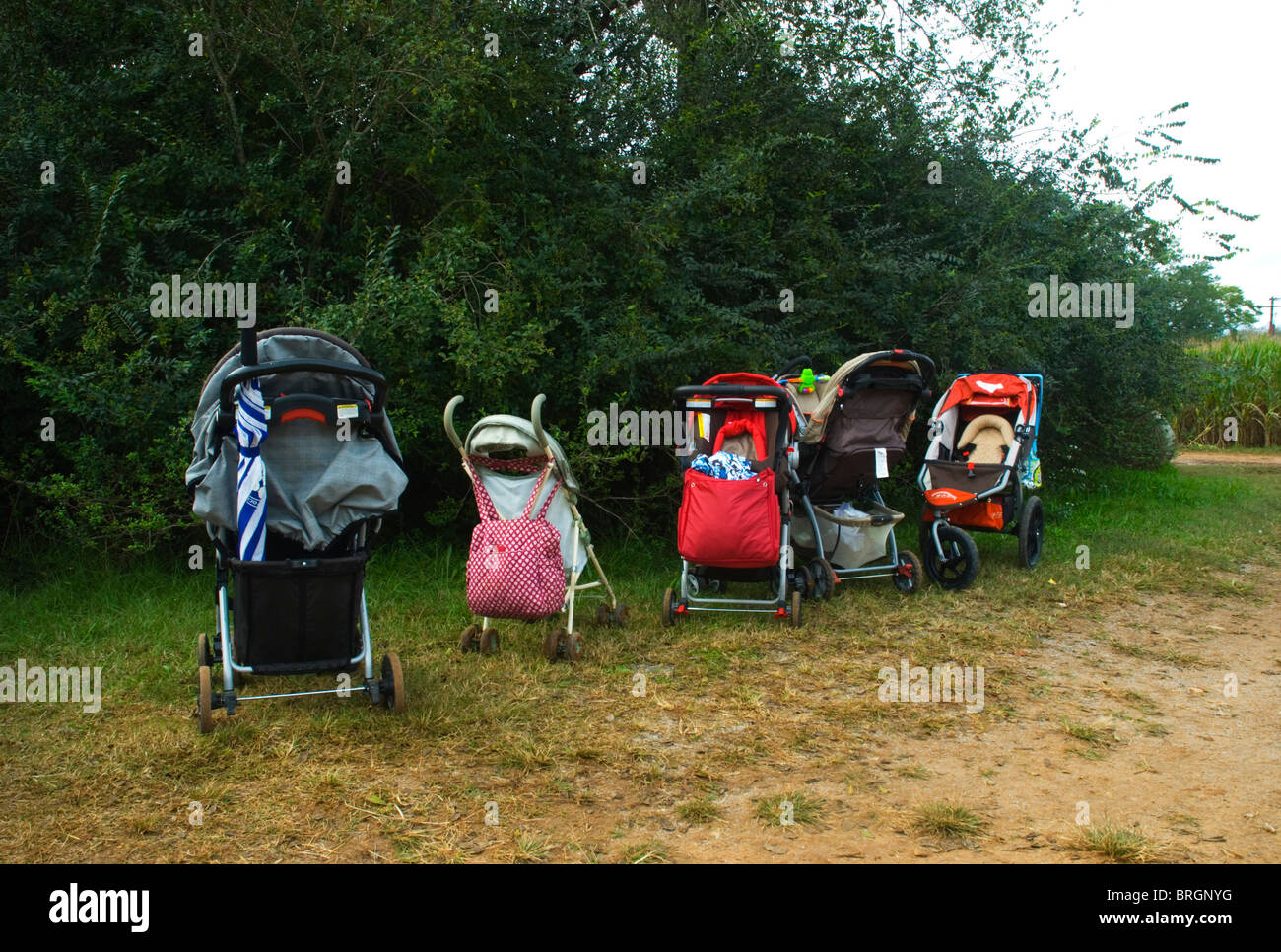 Empty baby carriages outside Stock Photo - Alamy