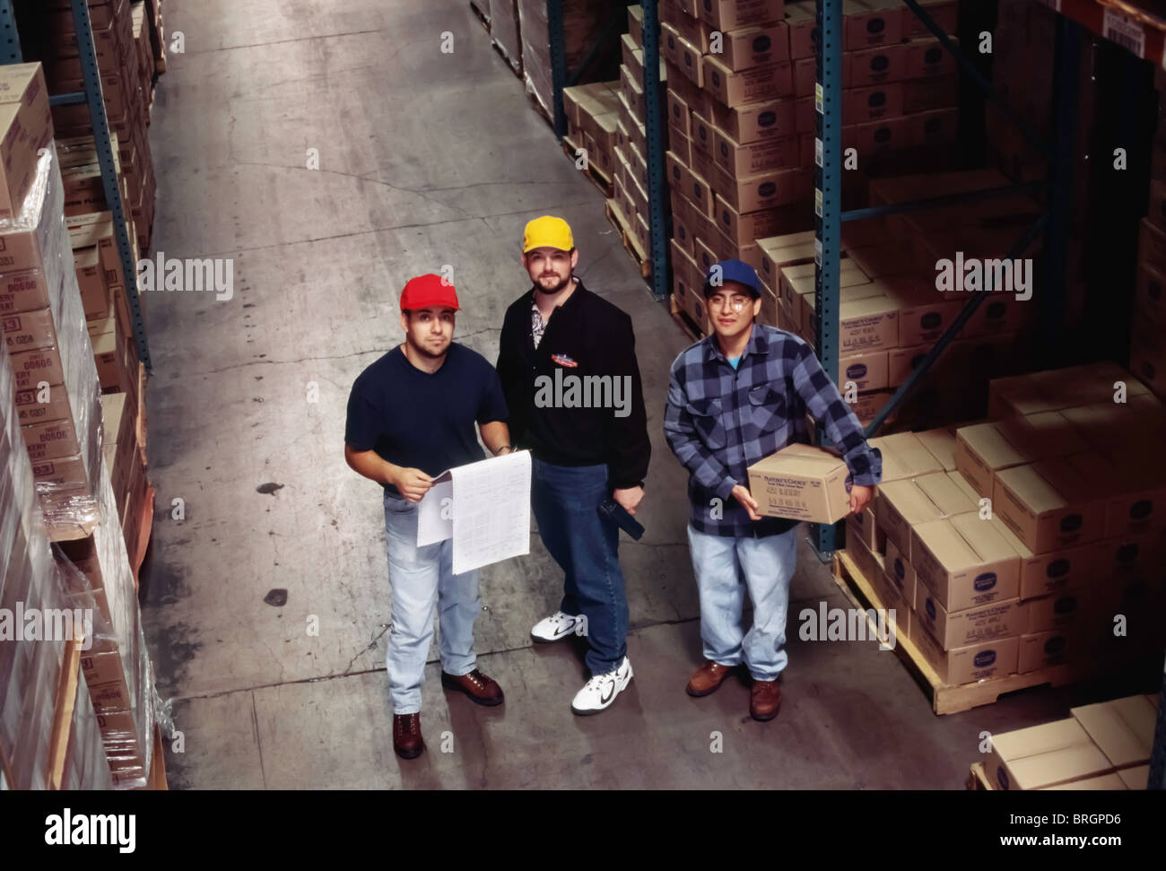 Three Workers Taking Inventory of Warehouse Stock - Vintage 1990s Stock ...