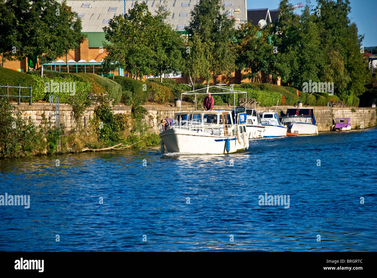 Boats on a river Stock Photo - Alamy