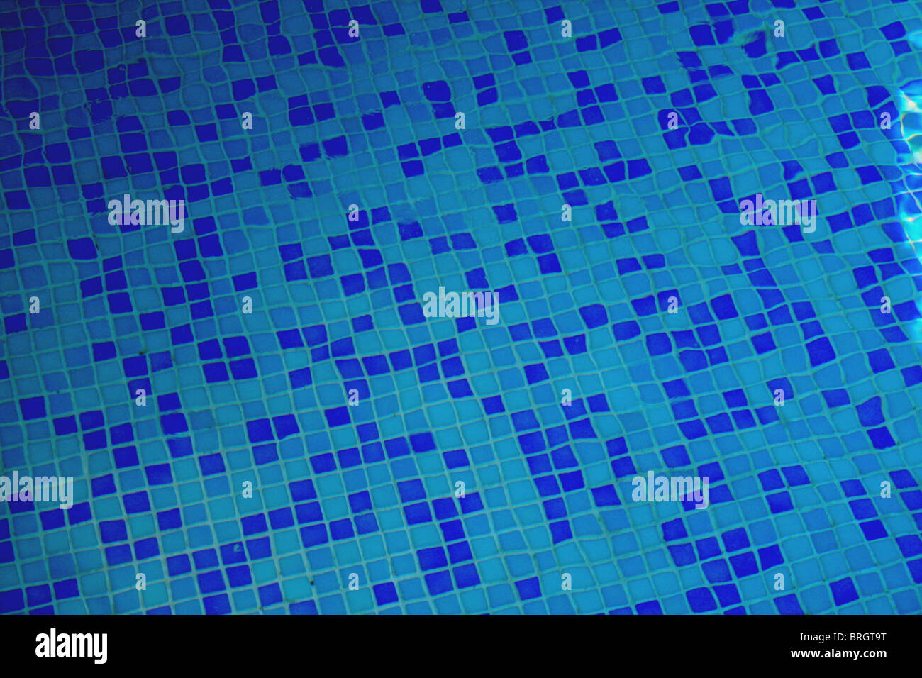 a blue tiled bottom to a swimming pool Stock Photo - Alamy