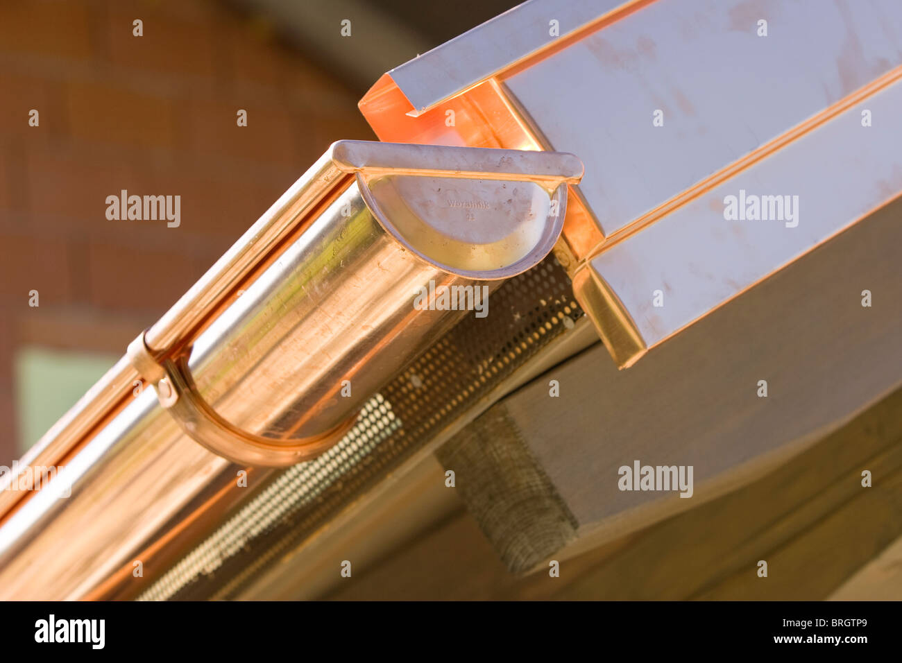Shining copper rain pipe Stock Photo - Alamy