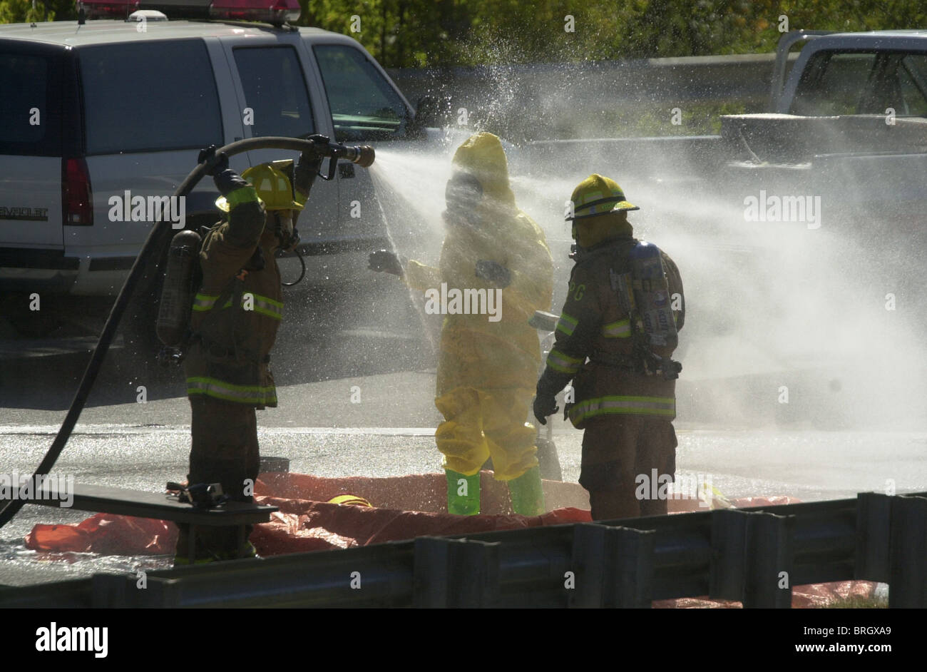 hazardous materials worker is sprayed down on Capitol Hill as buildings ...
