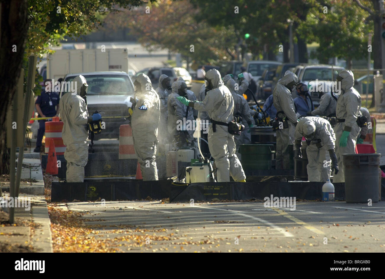 hazardous materials worker is sprayed down on Capitol Hill as buildings ...