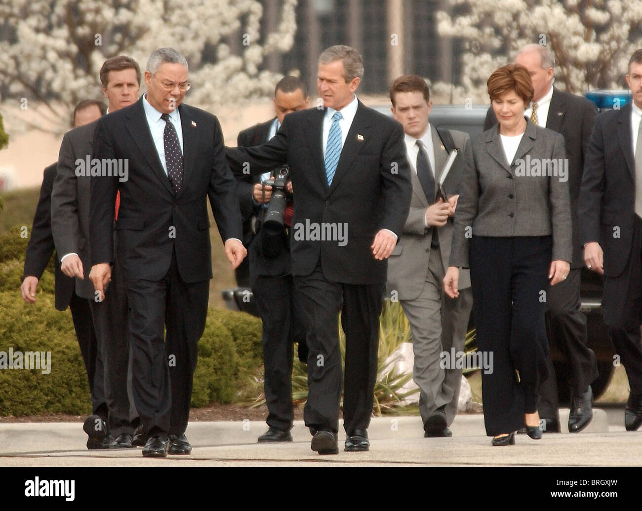 President Bush and wife Laura walk with Secretary of State Colin Powell ...