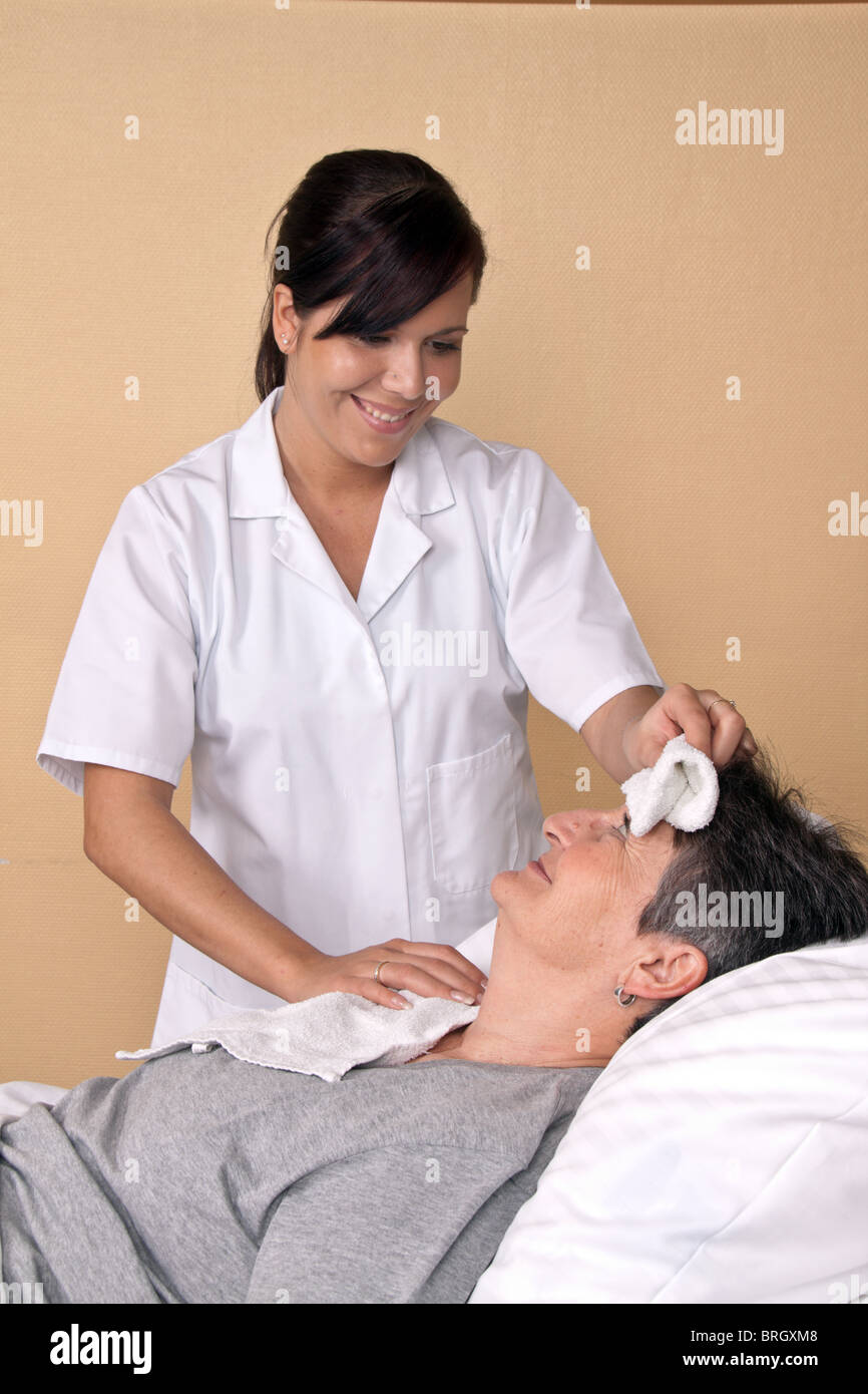 A nurse washes a patient Stock Photo - Alamy