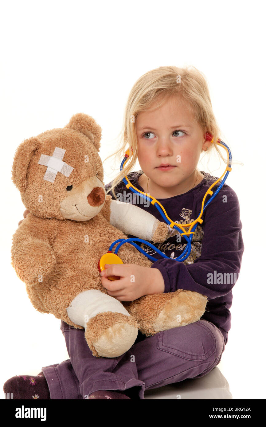 Child with a stethoscope like a doctor. Pediatrician examined patients ...