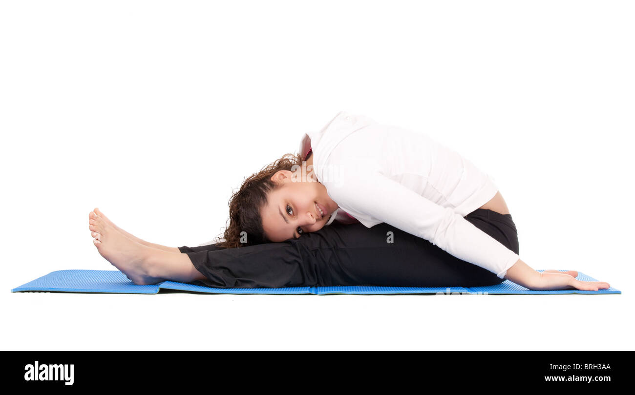 flexible young woman stretching body on exercise mat Stock Photo - Alamy