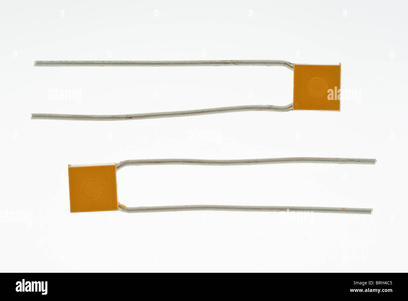 Pair of capacitors isolated on whited Stock Photo - Alamy