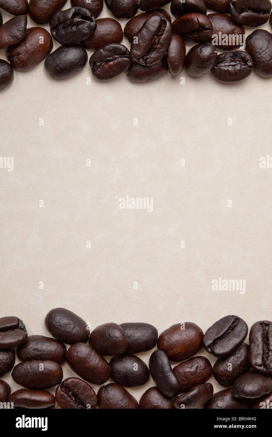 coffee beans on a parchment paper background Stock Photo - Alamy