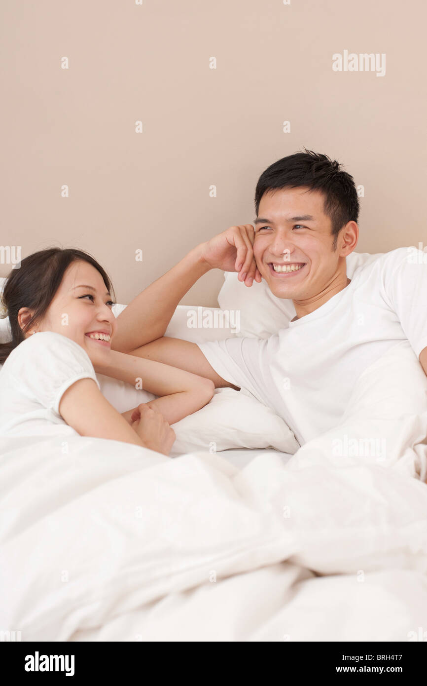 Asian Couple Waking Up In High Resolution Stock Photography and Images ...