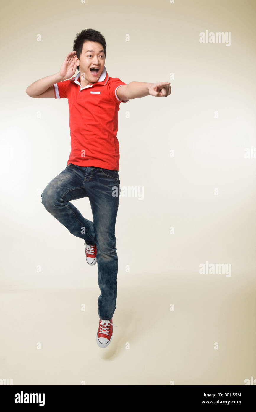 Young man in mid-air Stock Photo - Alamy