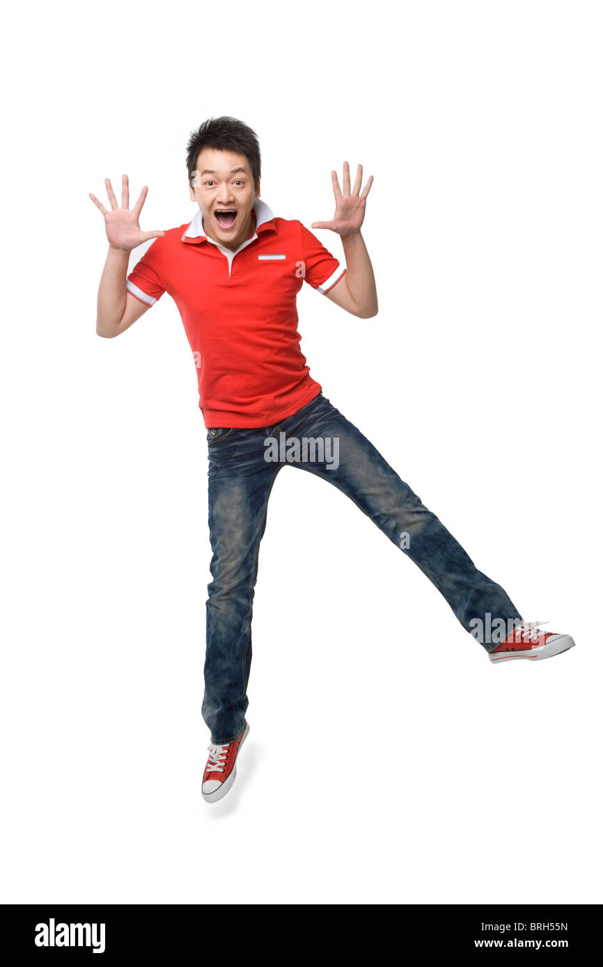 Young man in mid-air Stock Photo - Alamy
