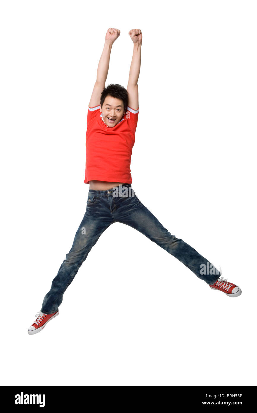 Young man in mid-air Stock Photo - Alamy