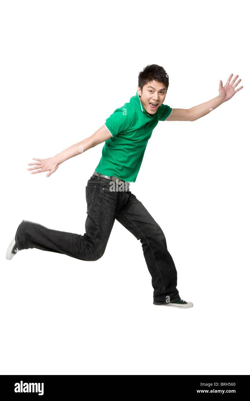 Young man in mid-air Stock Photo - Alamy