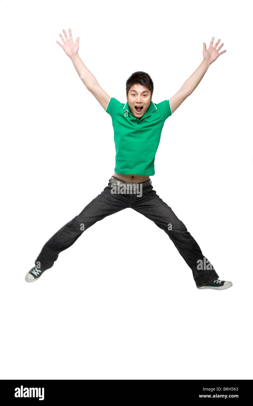 Young man in mid-air Stock Photo - Alamy