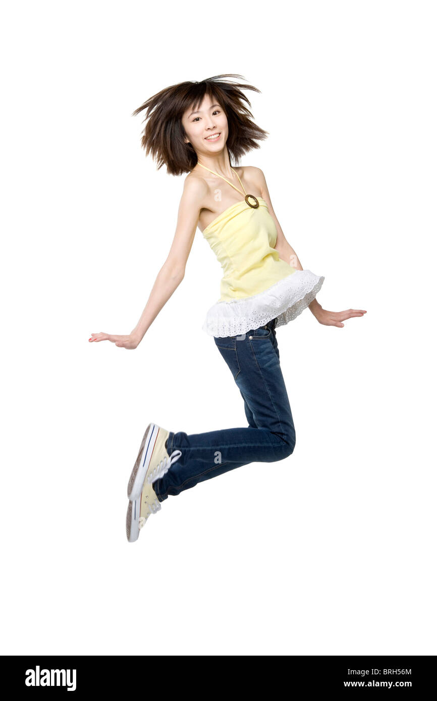 Young woman in mid-air Stock Photo - Alamy