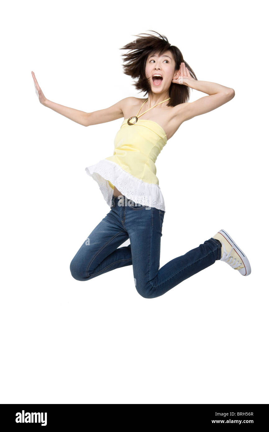 Young woman in mid-air Stock Photo - Alamy