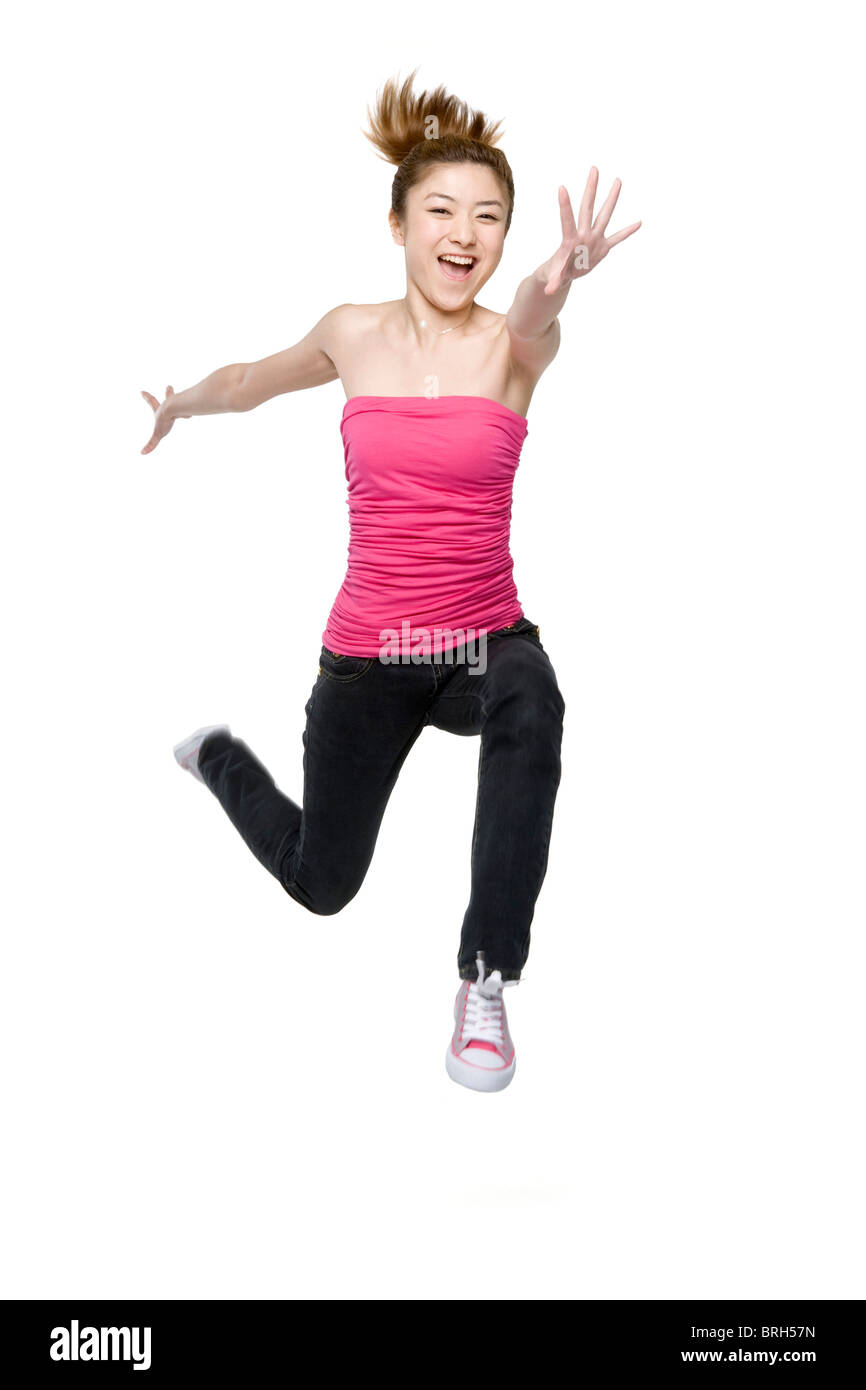 Young woman in mid-air Stock Photo - Alamy