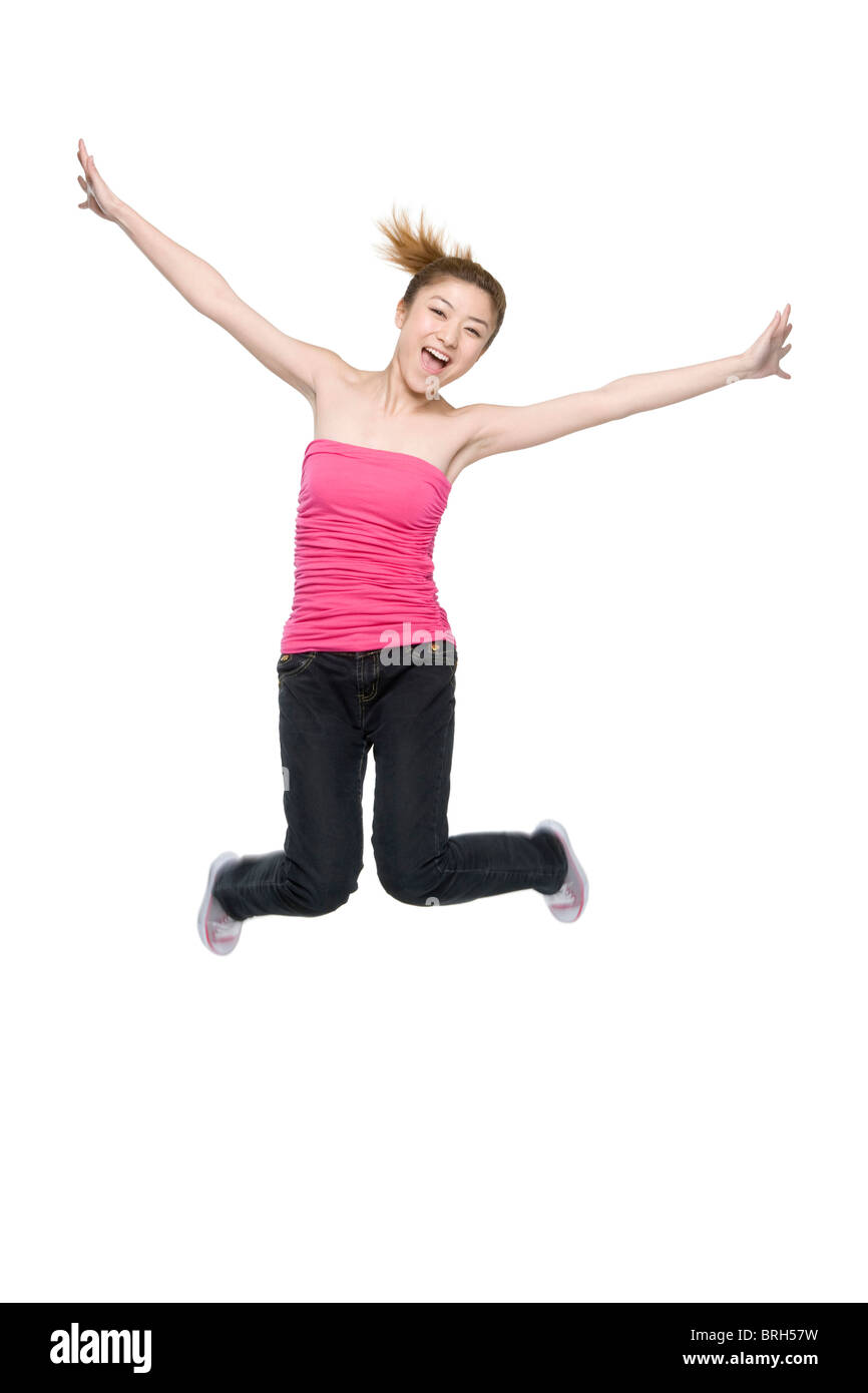 Young woman in mid-air Stock Photo - Alamy
