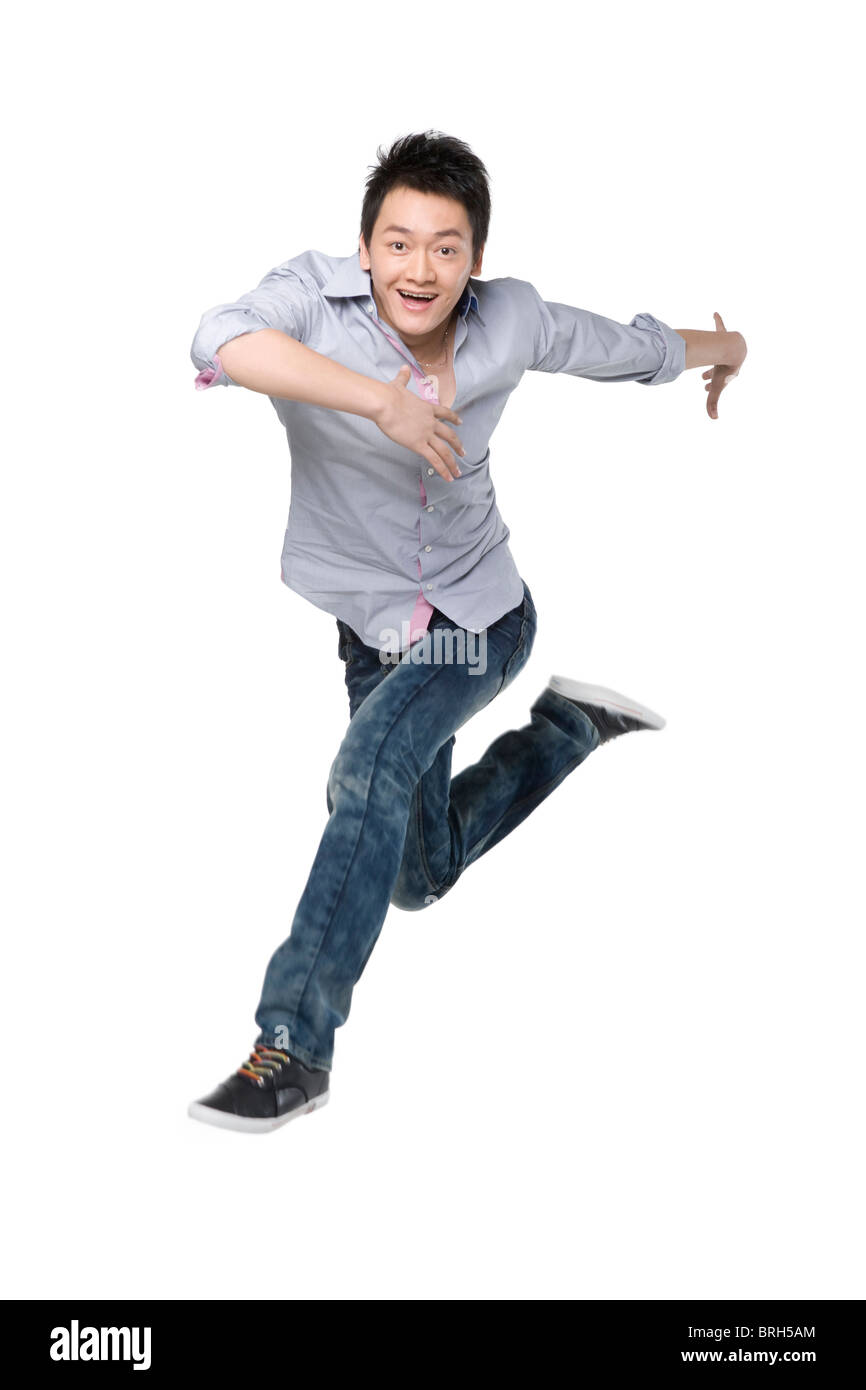 Young man in motion Stock Photo - Alamy