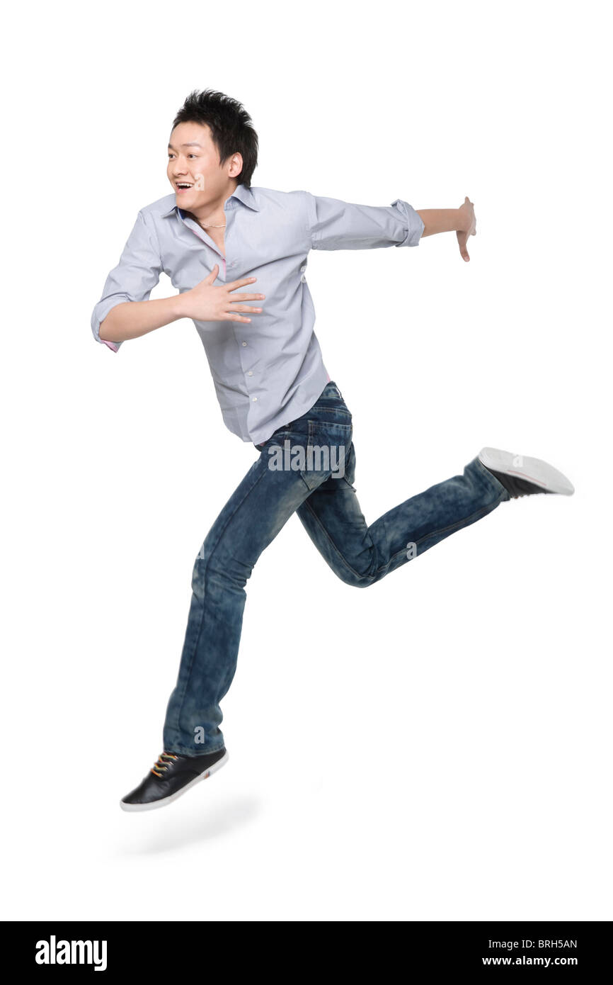 Man in jeans running Cut Out Stock Images & Pictures - Alamy