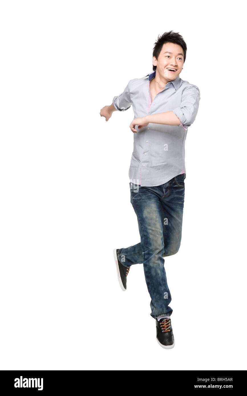 Young man in motion Stock Photo - Alamy