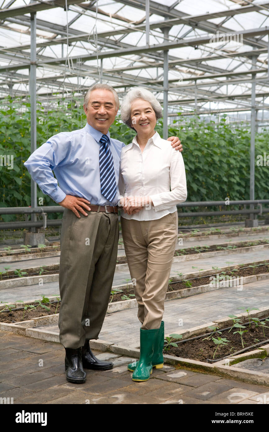 Senior couple in modern farm Stock Photo - Alamy